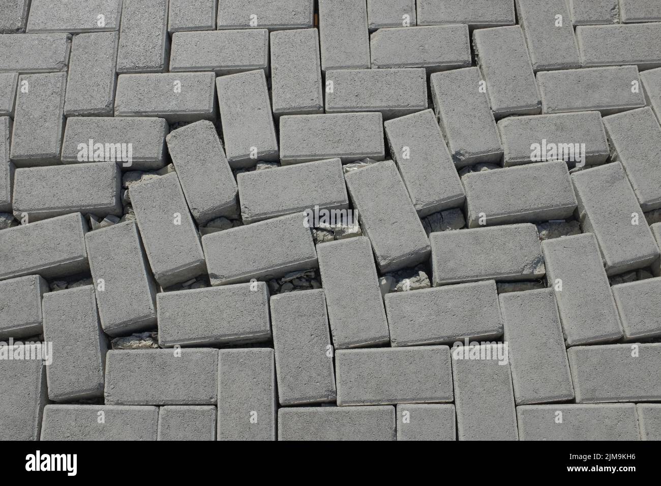 Out of place concrete street tiles; broken, uneven pathway; dislocated ...