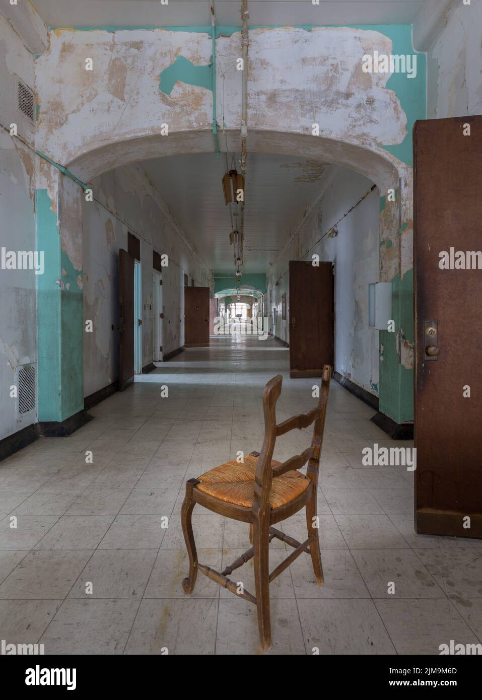 Long corridor inside Trans-Allegheny Lunatic Asylum Stock Photo - Alamy