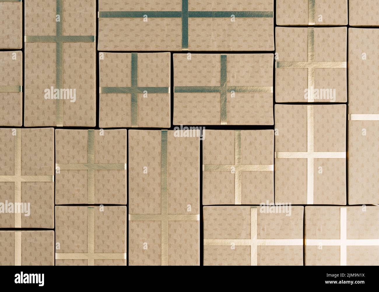 A collection of different sized rectangular gift boxes wrapped in ...