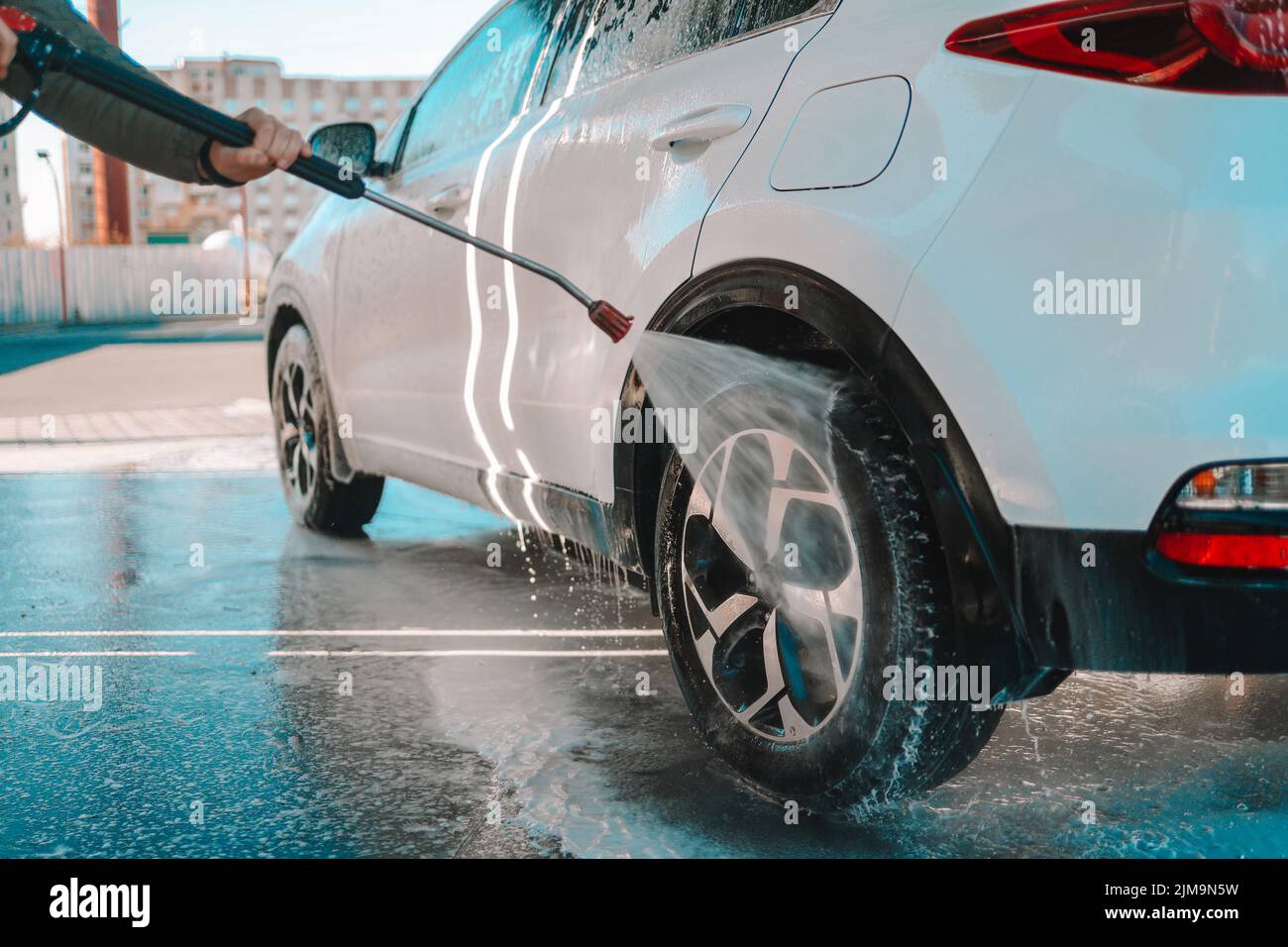 Manual car wash with pressurized water in car wash outside. Summer Car ...