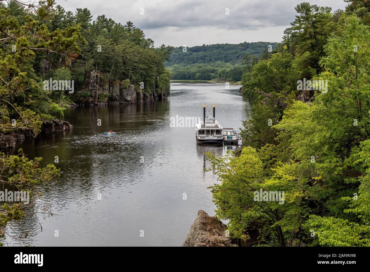 St. Croix River and river bluffs with a couple of kayakers and the ...