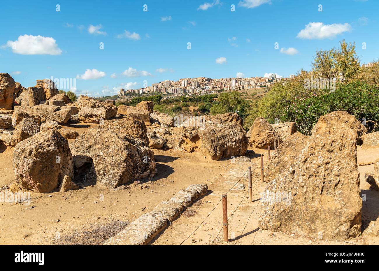 Archaeological Park of the Valley of the Temples with Agrigento town in ...