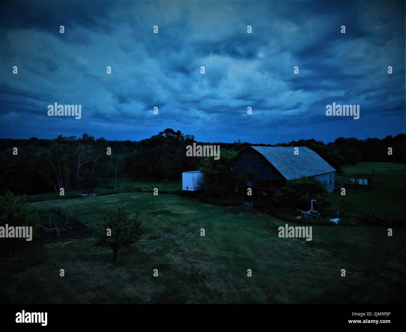 An aerial view of countryside rural house in a forest environment at ...