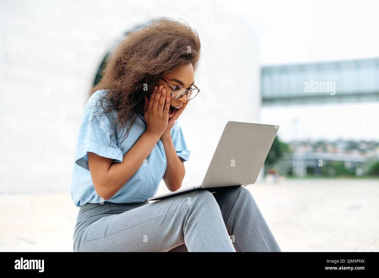 Shocked amazed stylish african american young woman, company worker ...