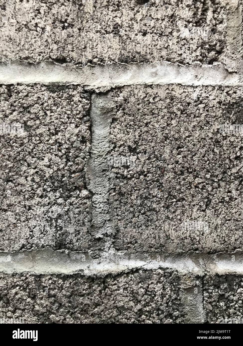 A closeup of a concrete brick wall texture Stock Photo - Alamy