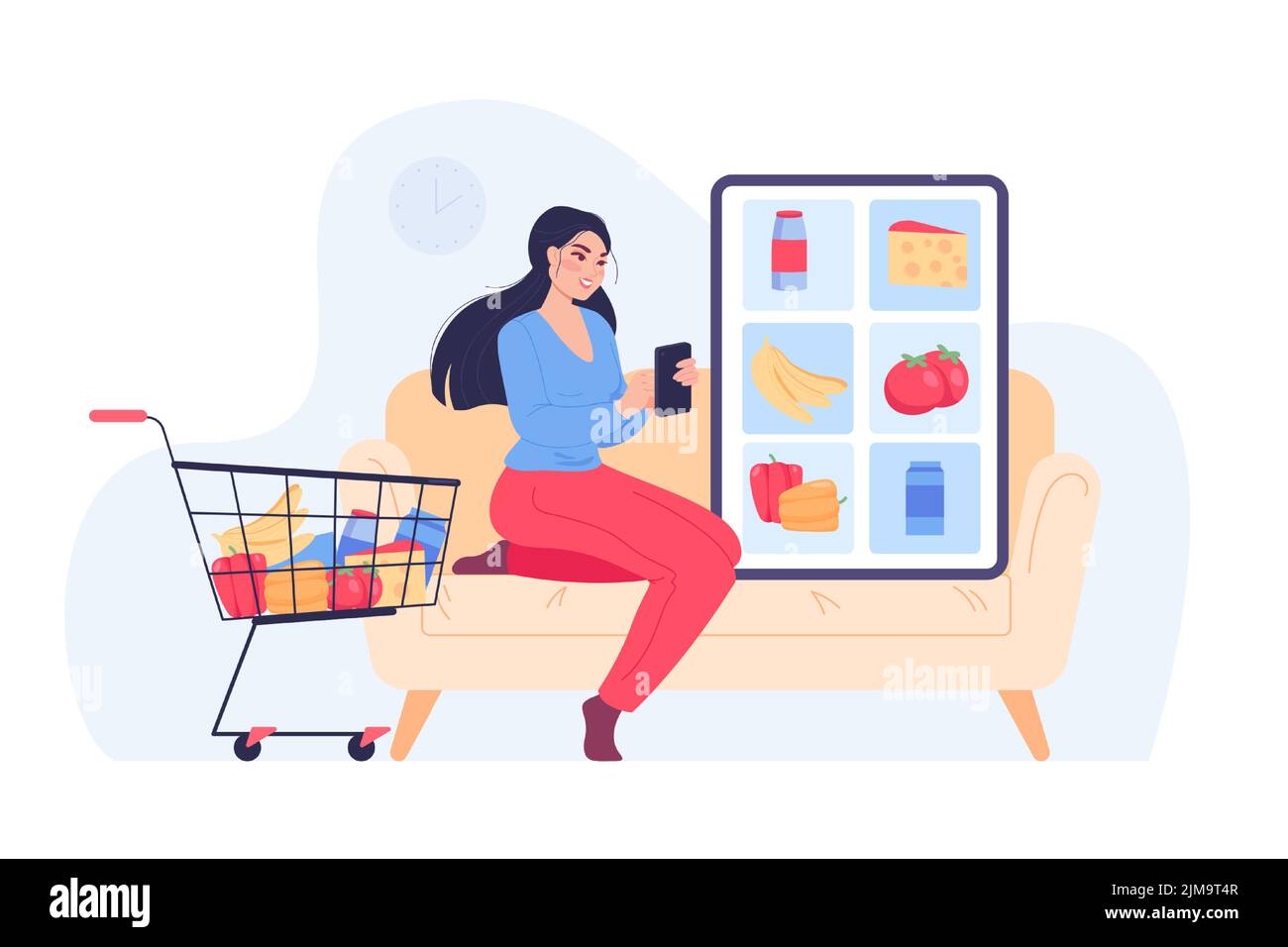 Shopping cart next to girl ordering food via mobile app. Tablet on sofa ...