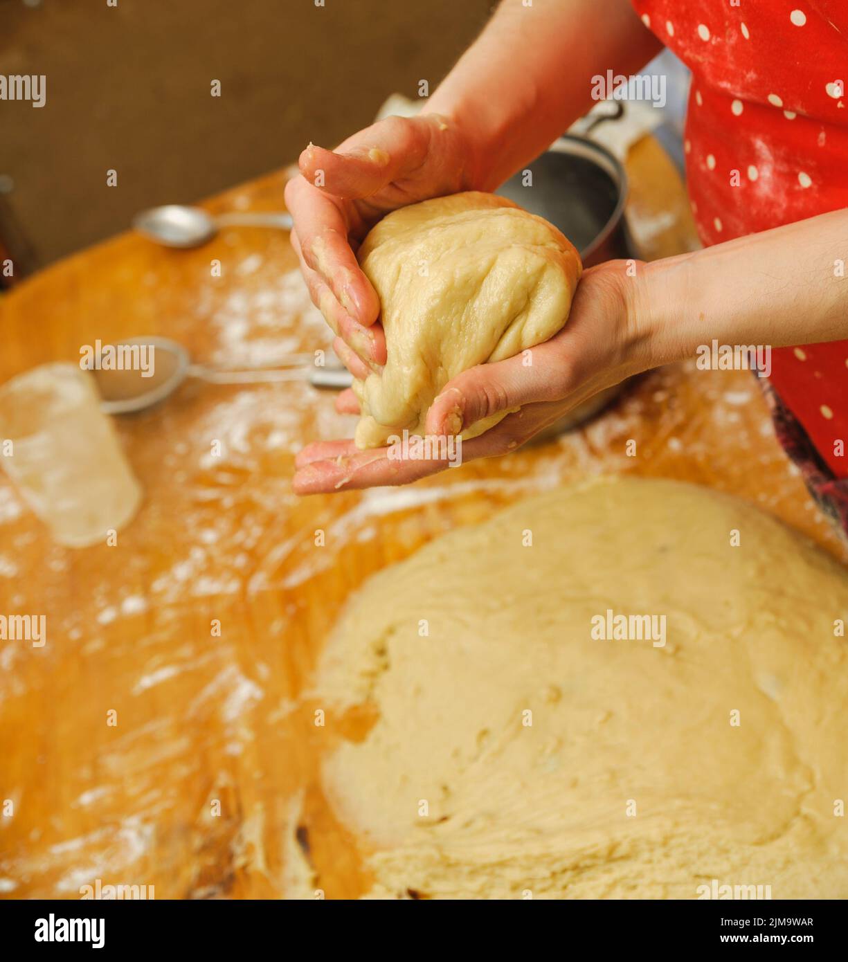 Prepare meal food. modelling dough in hands Stock Photo - Alamy