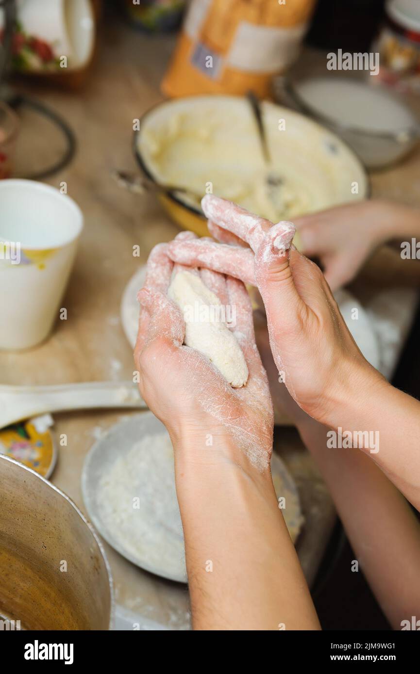 Prepare meal food. modelling dough in a hands Stock Photo - Alamy
