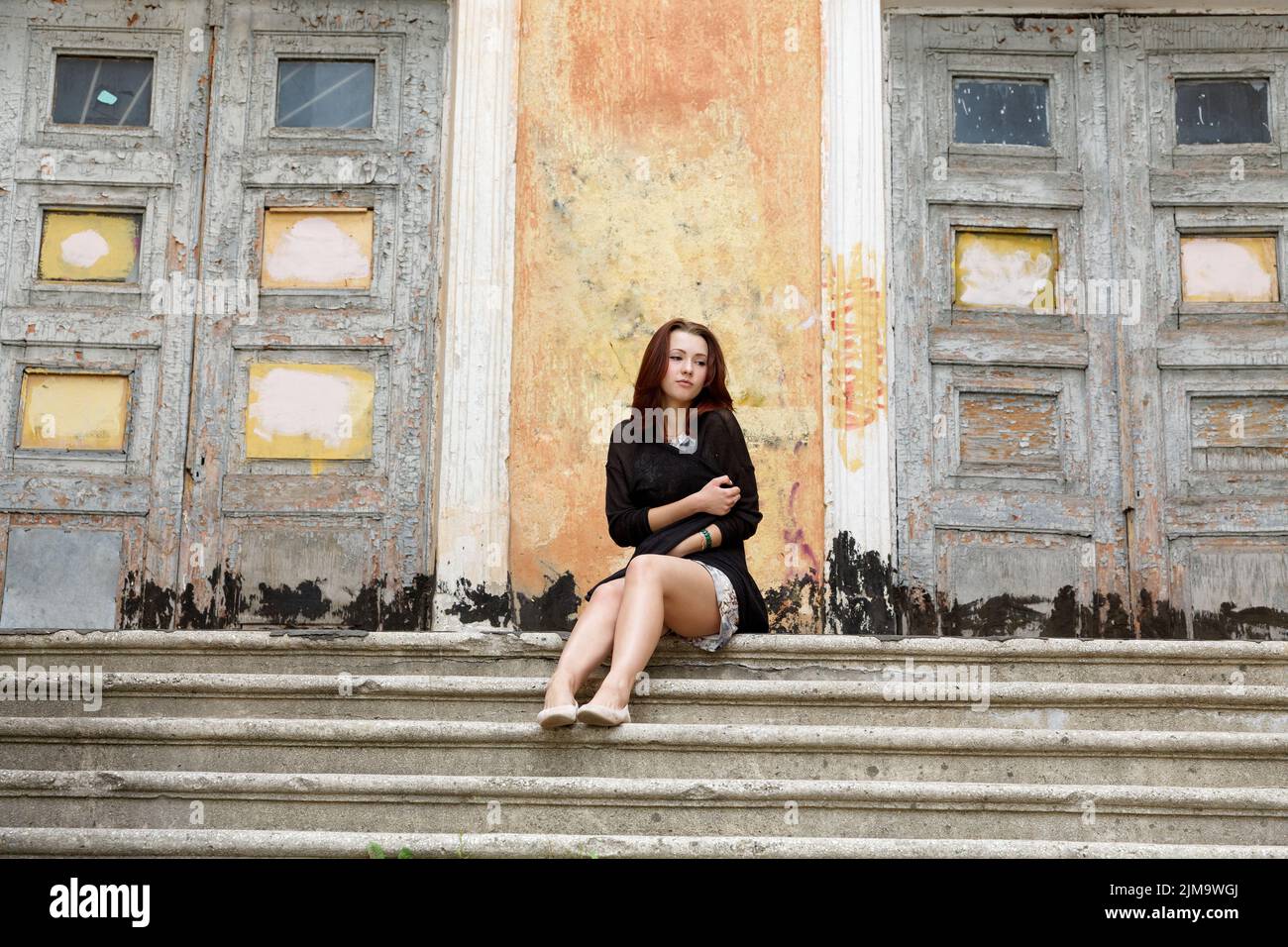 Sad girl sitting on stairs hi-res stock photography and images - Alamy