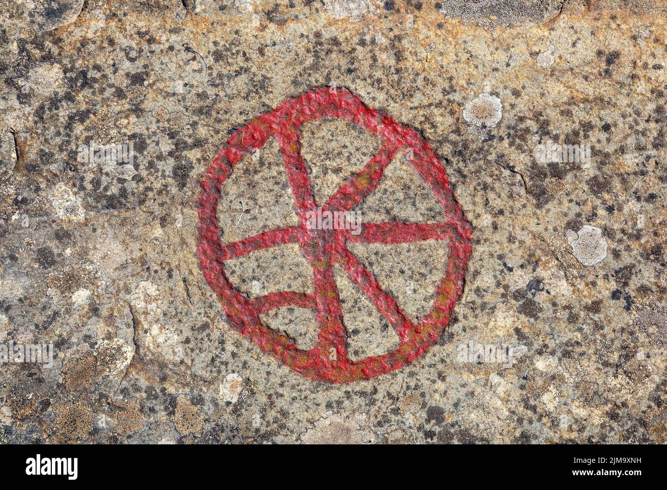 Wheel Petroglyphs figures on a rock Stock Photo - Alamy