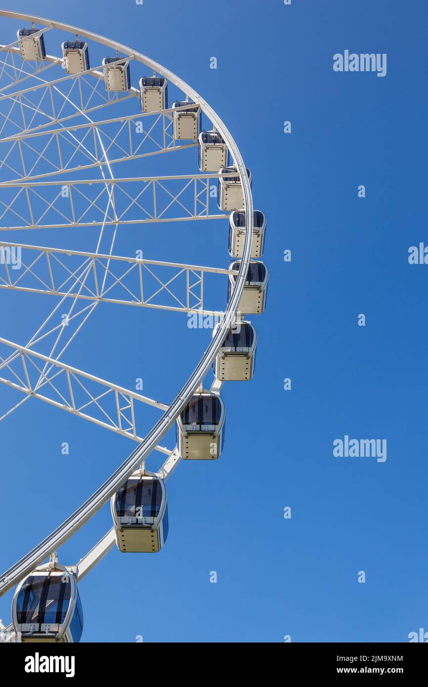Ferris wheel against a blue sky Stock Photo - Alamy