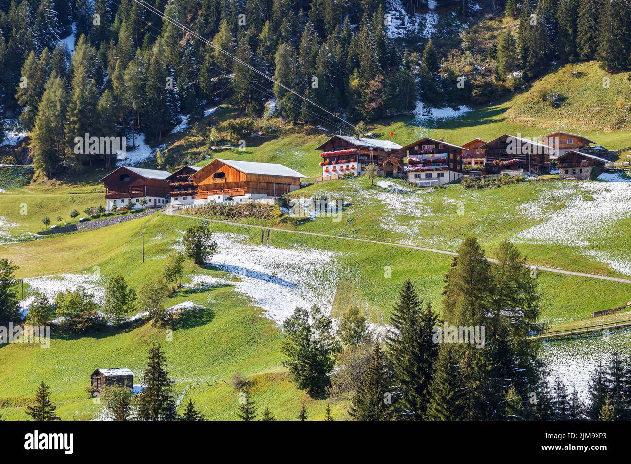 Beautiful Alp village on a mountainside Stock Photo - Alamy