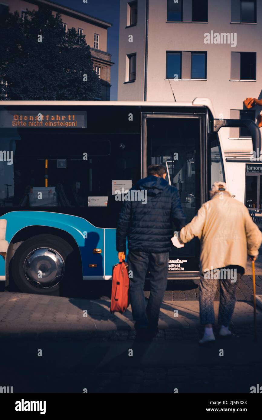 Helping elderly cross street hi-res stock photography and images - Alamy