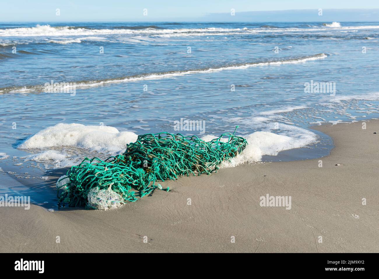 Green fishing net on the beach Stock Photo - Alamy