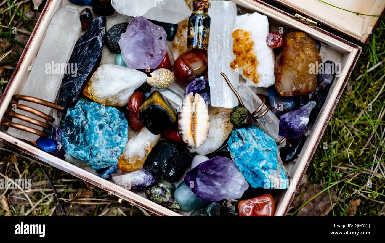A top view of healing mineral crystal stones in a box Stock Photo - Alamy