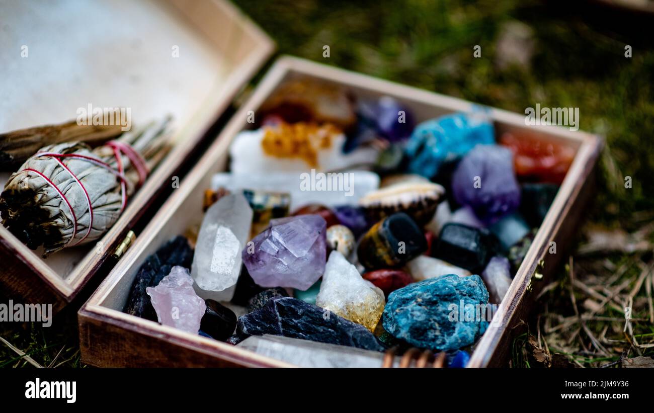 A box of colorful crystal stones for holistic ritual, importance of ...