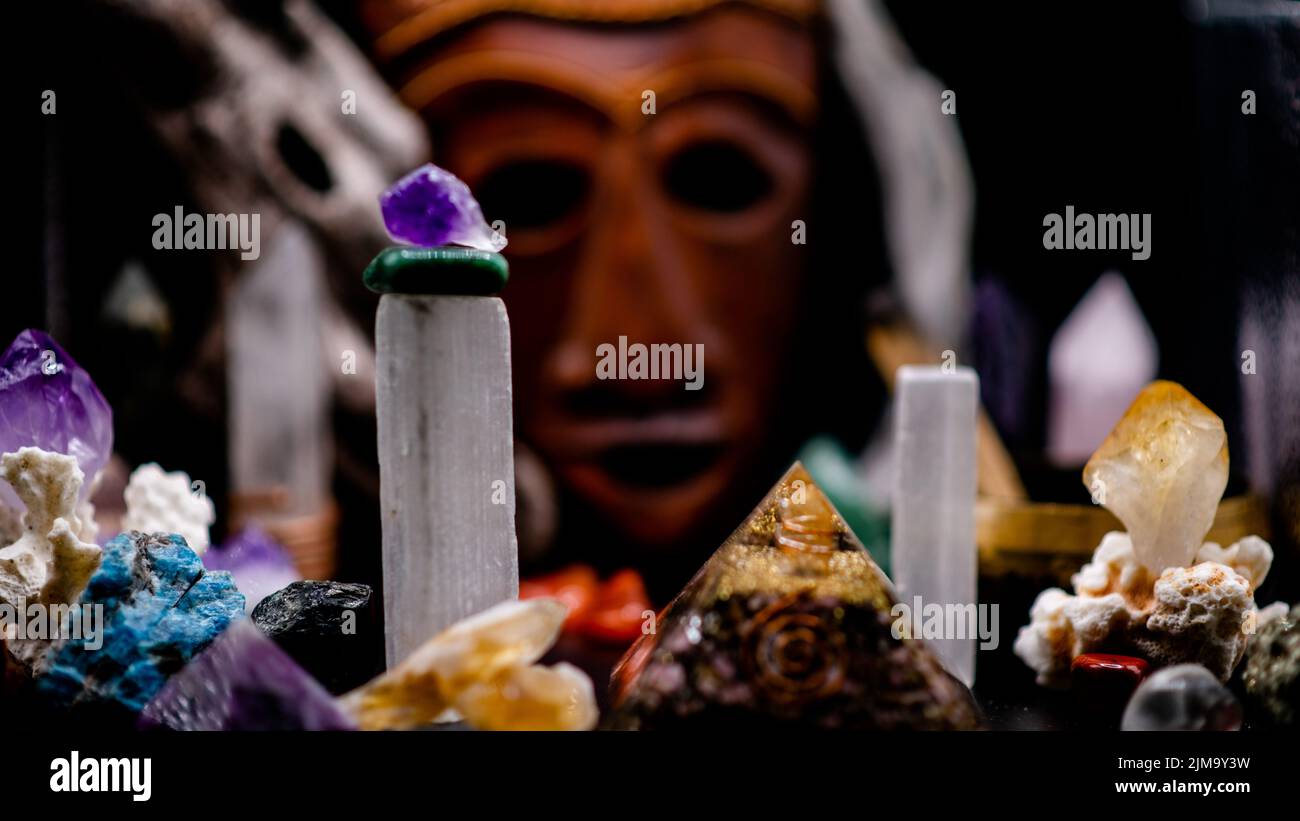 The healing mineral crystal stones and wooden african mask in the ...
