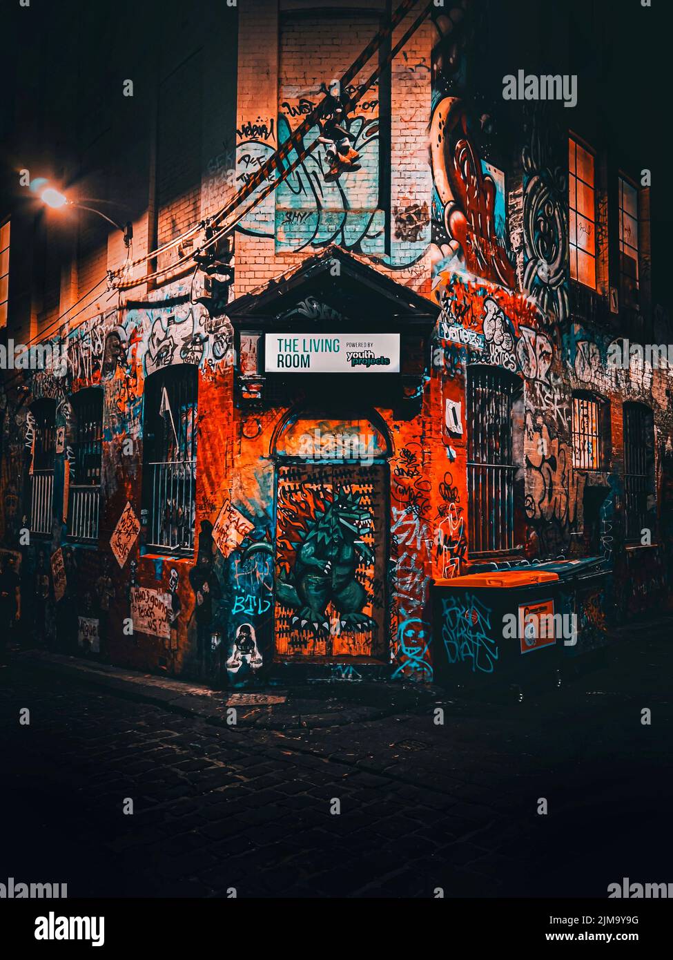 A vertical shot of a building in Melbourne with cool graphite art at ...