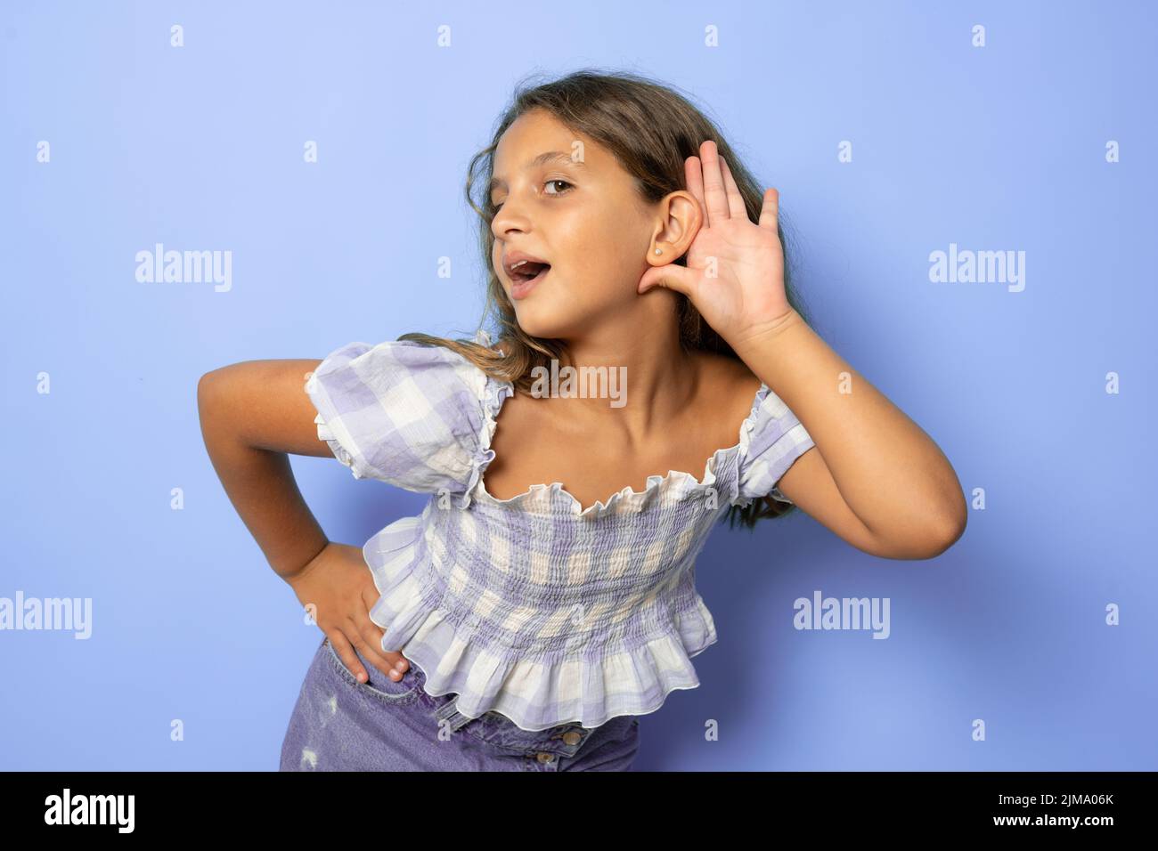 Little girl trying to hear you overhear listening intently isolated on ...