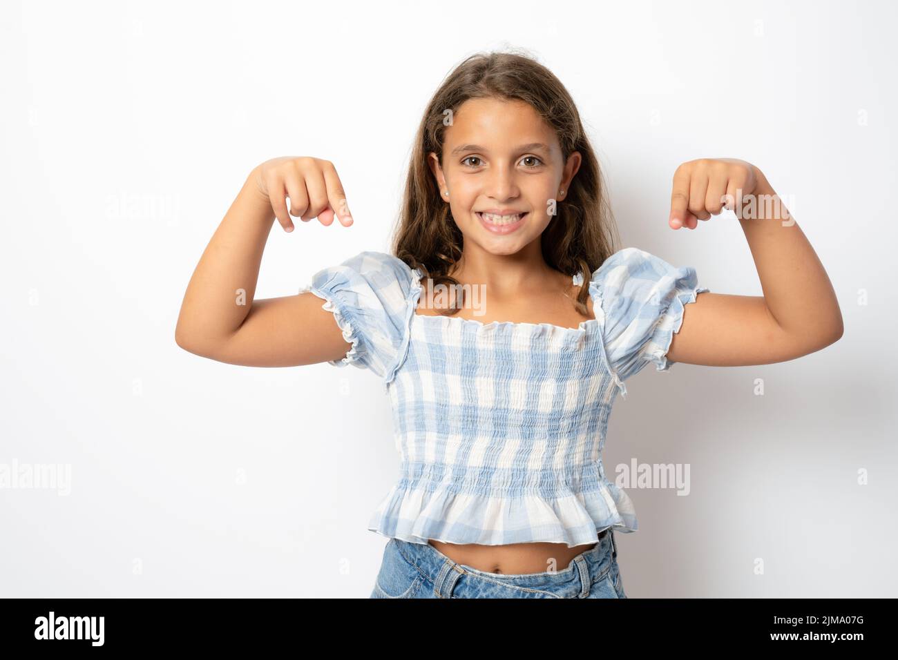 Look, it is amazing. Pleased curious smart little girl with brown hair ...