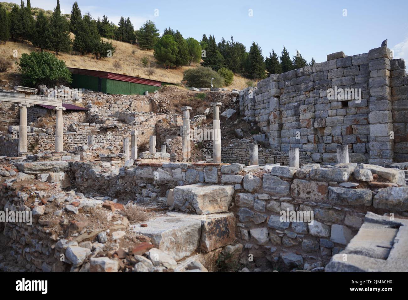 A scenic view of the famous ruins in ancient port city of Ephesus, Turkey under clear blue sky ...