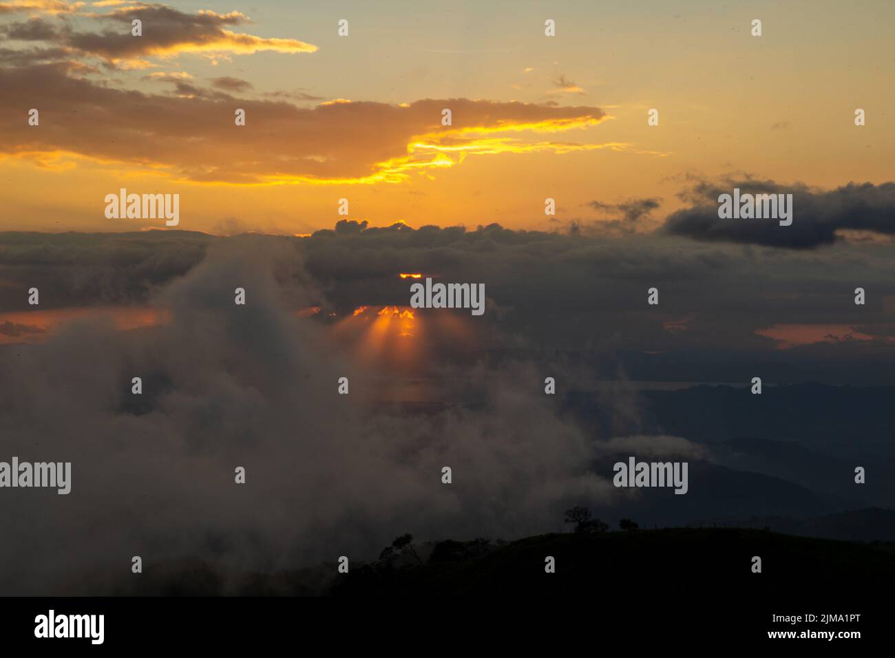A dramatic cloudy sky during sunset Stock Photo - Alamy