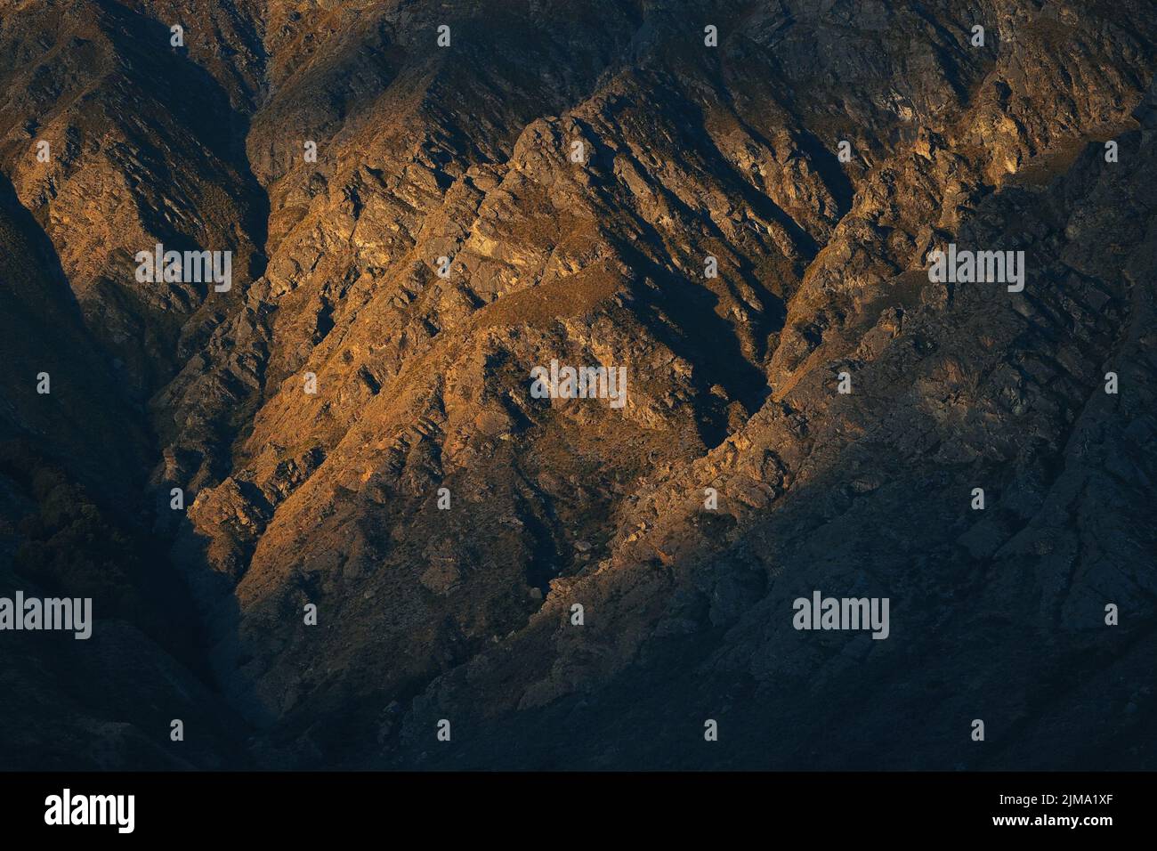 An aerial view of rocky mountain under shadow Stock Photo - Alamy
