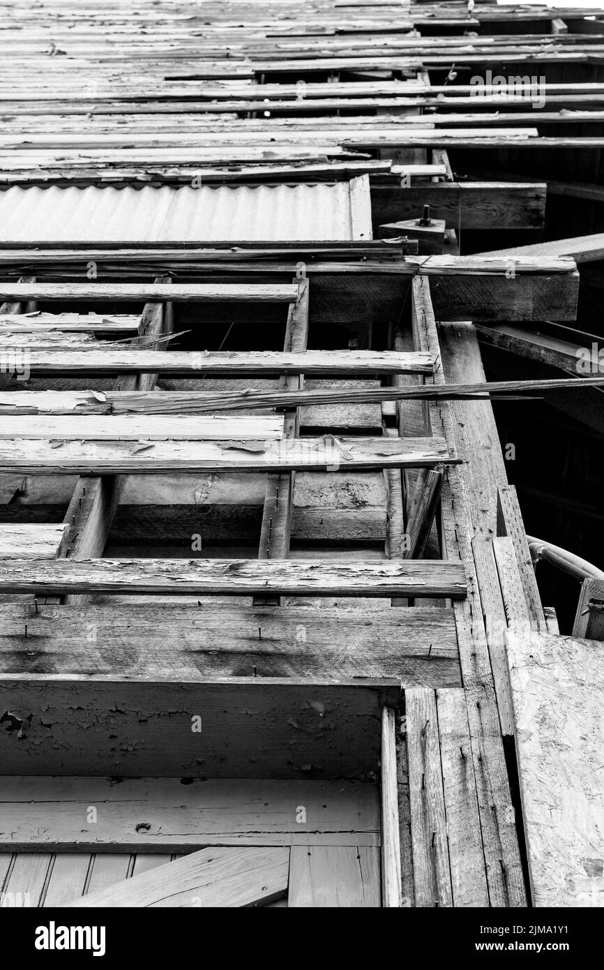 A grayscale of wooden docks on a shore Stock Photo - Alamy