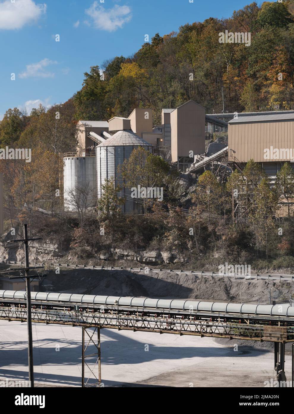 Limestone or crushed stone factory in wooded valley Stock Photo - Alamy