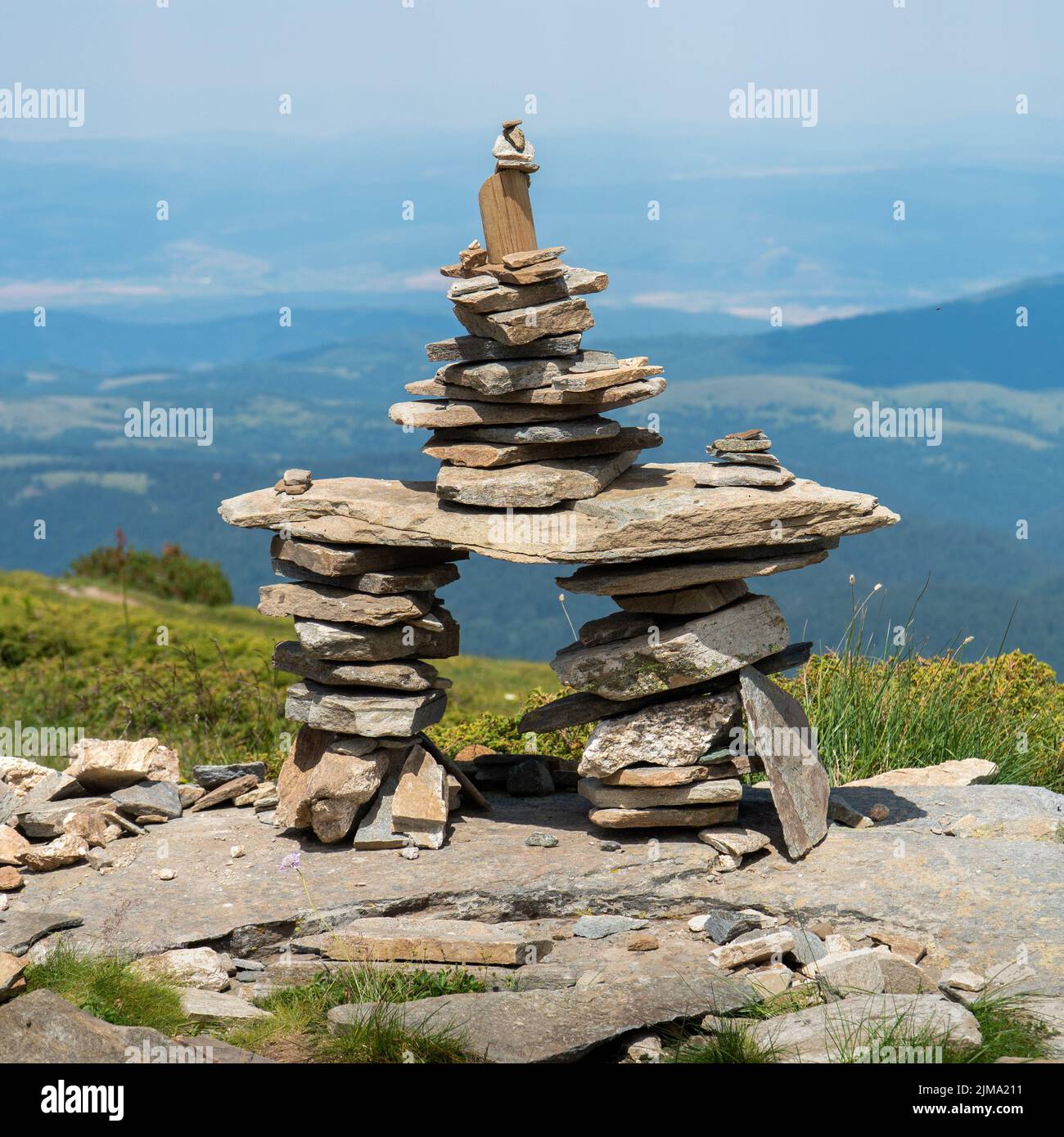 The stone stack with balanced stones on blurred mountain background ...