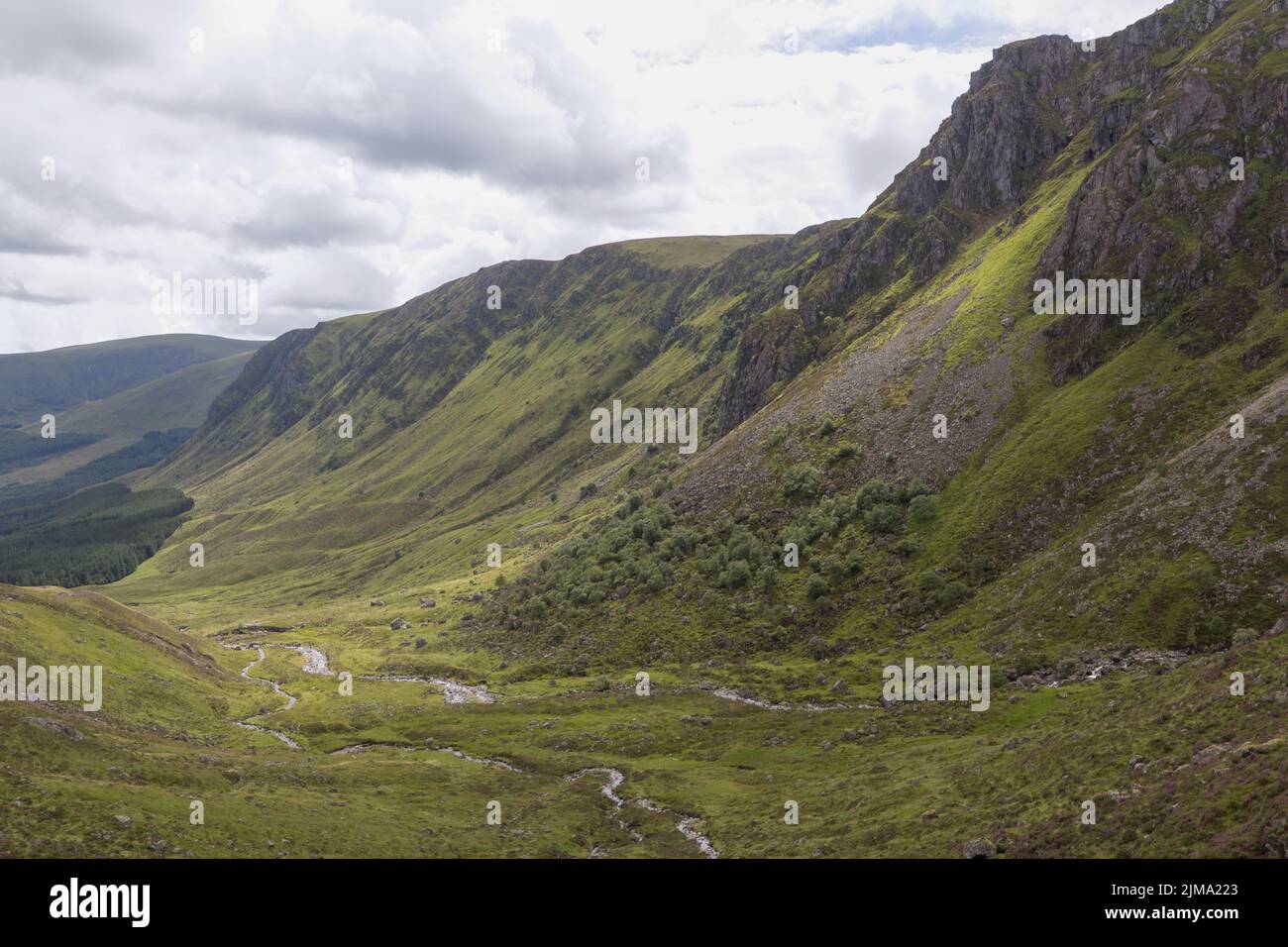A beautiful natural scenery view of green mountains and hills under a ...