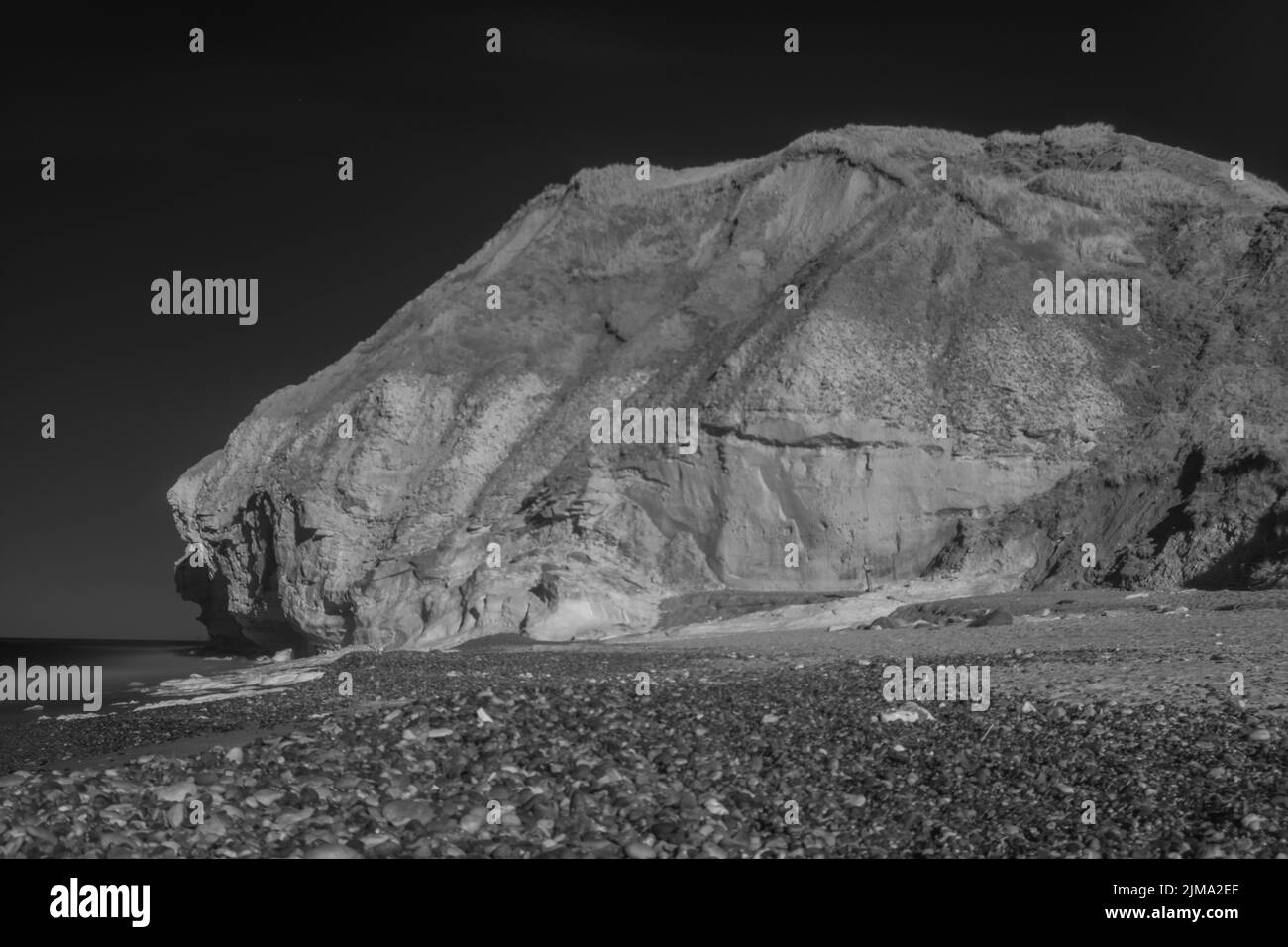 a grayscale of Bulbjerg limestone cliff in northern Jutland, Denmark ...