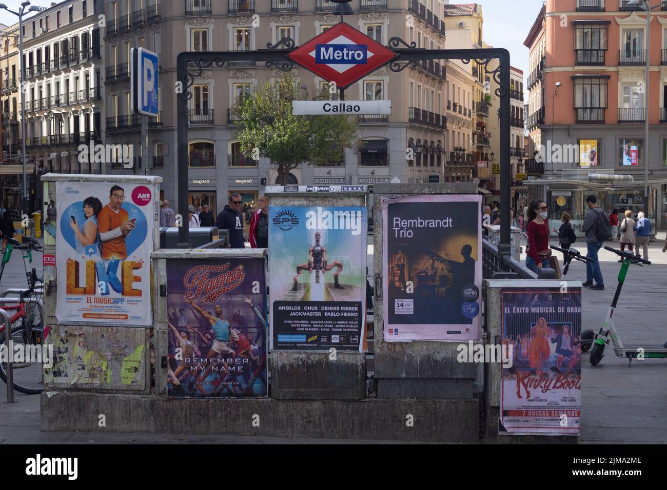 A Madrid metro station displays several advertising posters in Spain ...