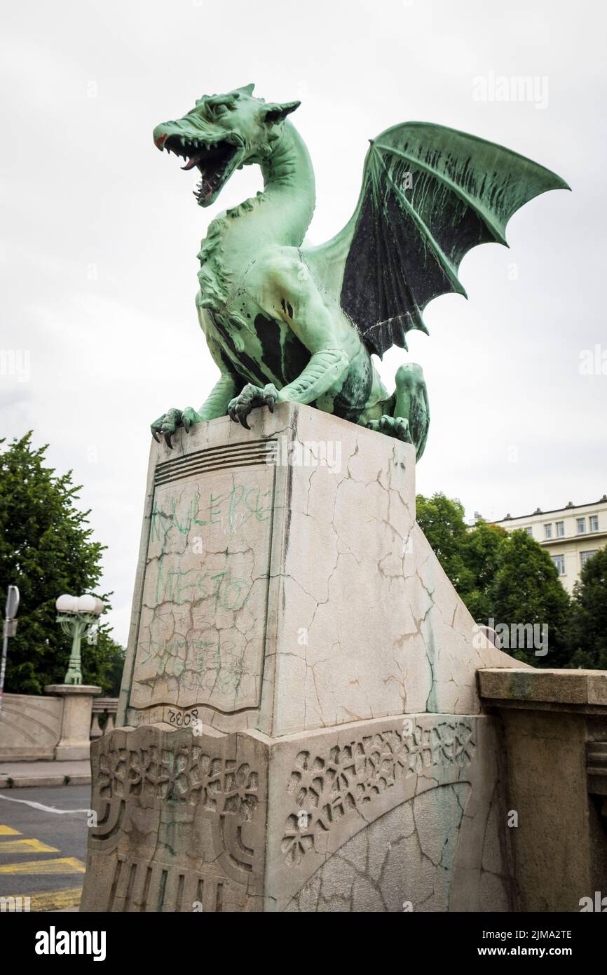Slovenia, Ljubljana, Dragon Bridge dragon statue on the Dragon bridge ...