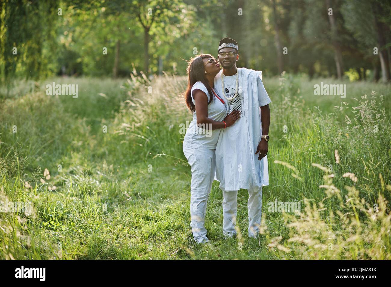 Black african couple in love kissing at green park on sunset Stock ...