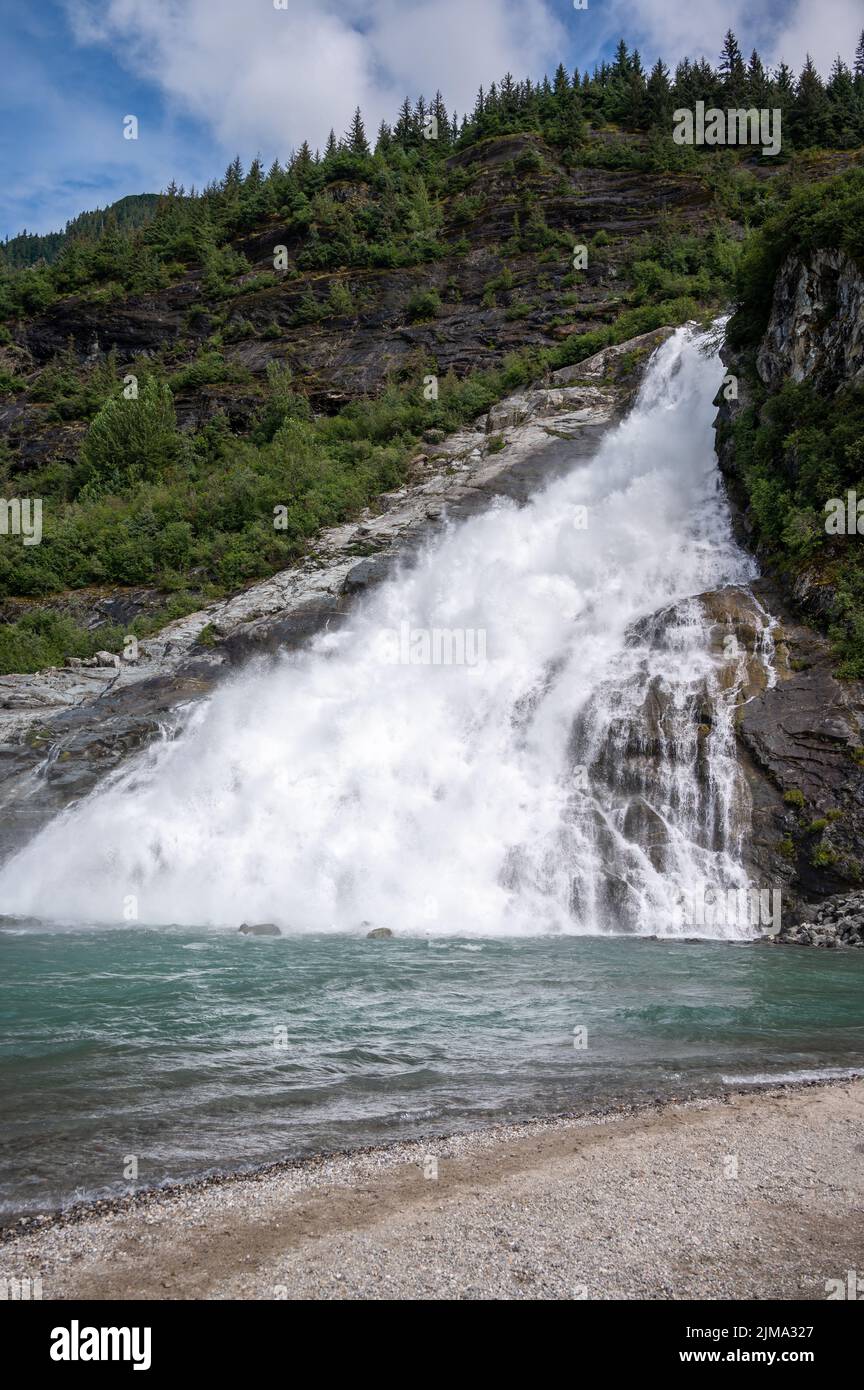 Views of the Nugget Falls the pours into the glacial lake at Mendenhall ...