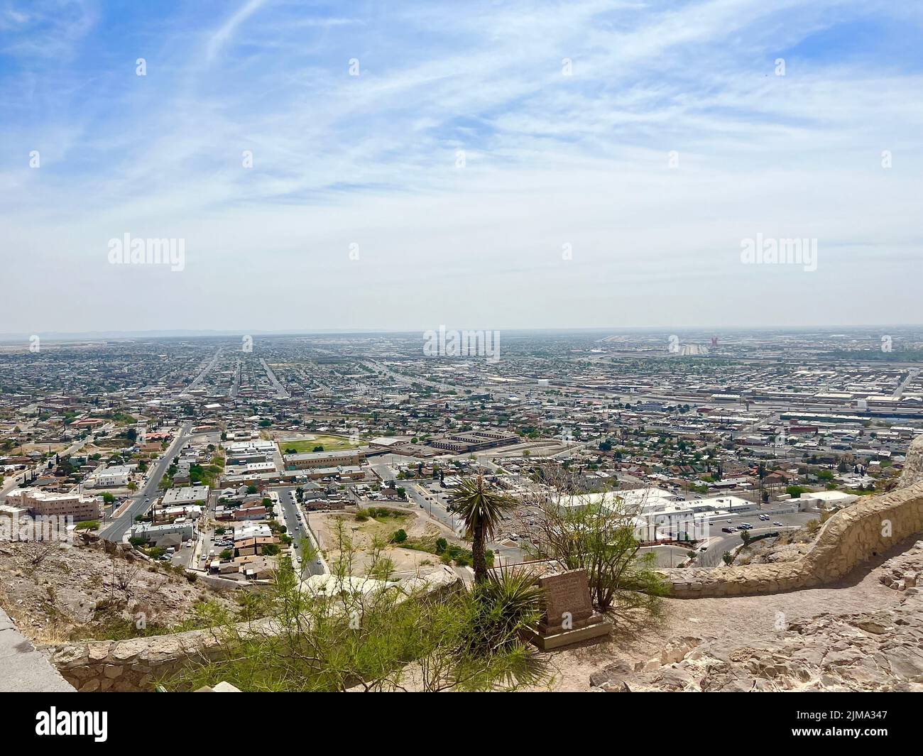 The top-view of the cityscape buildings and roads under the blue sky ...