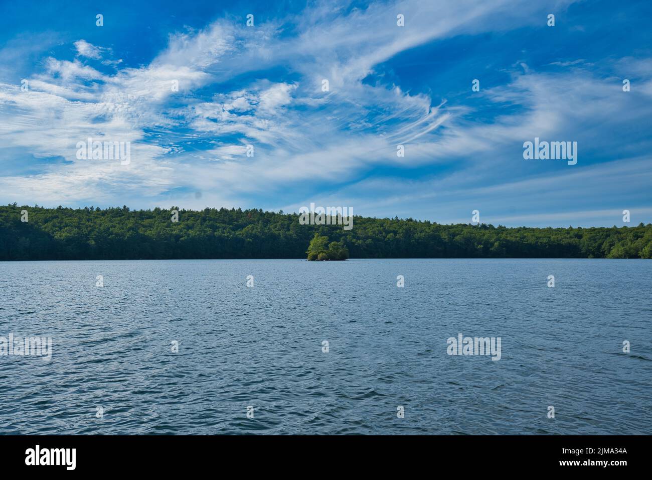 A breathtaking view of a river flowing through the dense green forests ...
