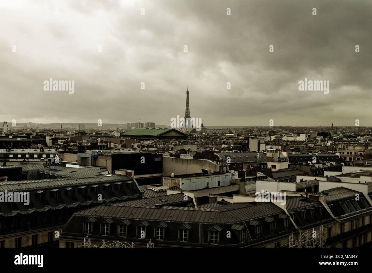 An aerial view of the cityscape of Paris in a rainy day with the Eifel ...