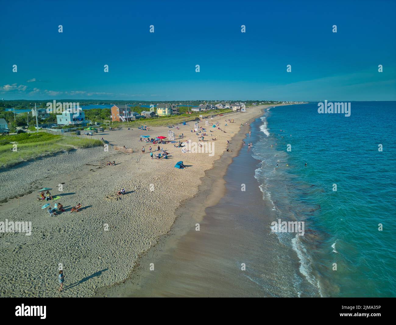 The sandy beach with people relaxing in Charlestown Breach of Rhode ...