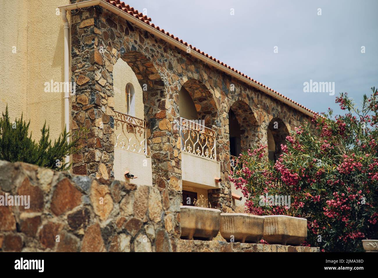 An exterior view of a beautiful residential house with a garden in a ...