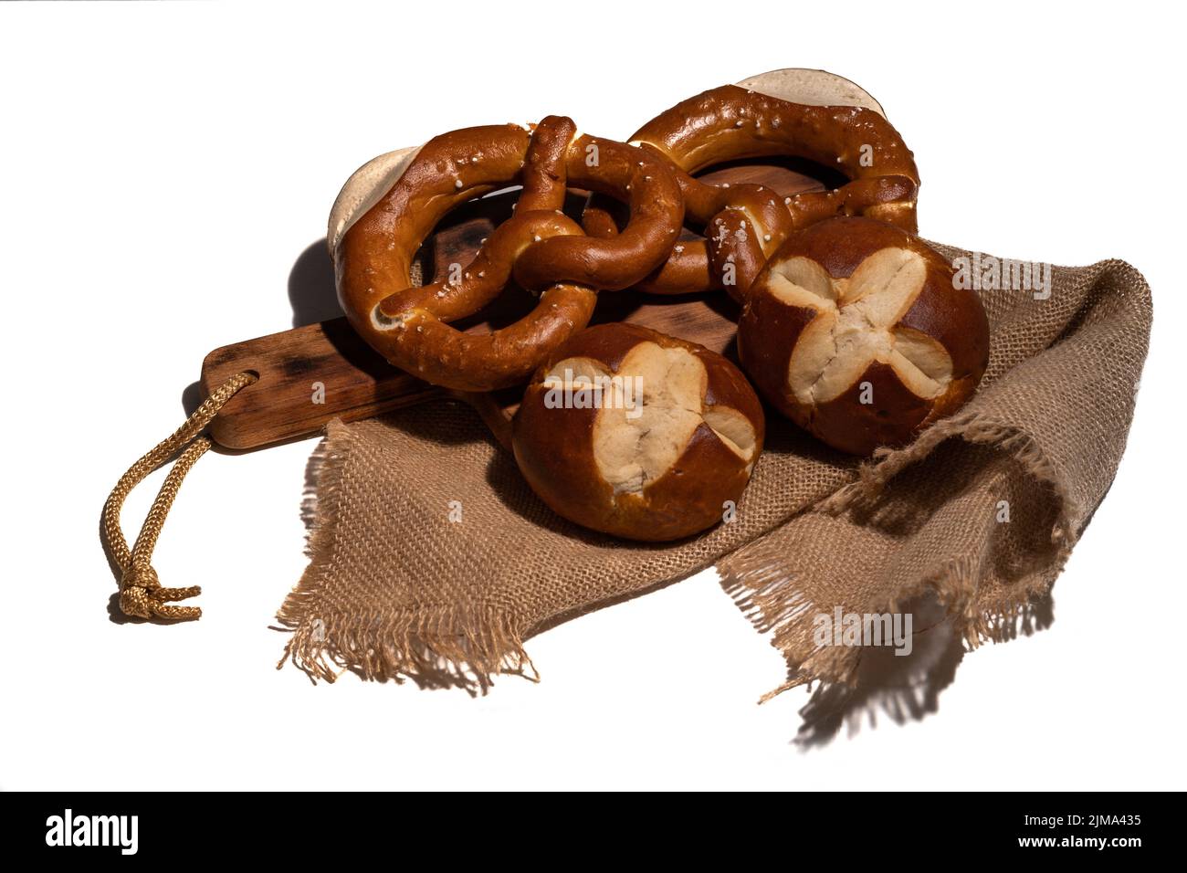babiera bread and wheat pretzel with a raffia cloth on a white ...