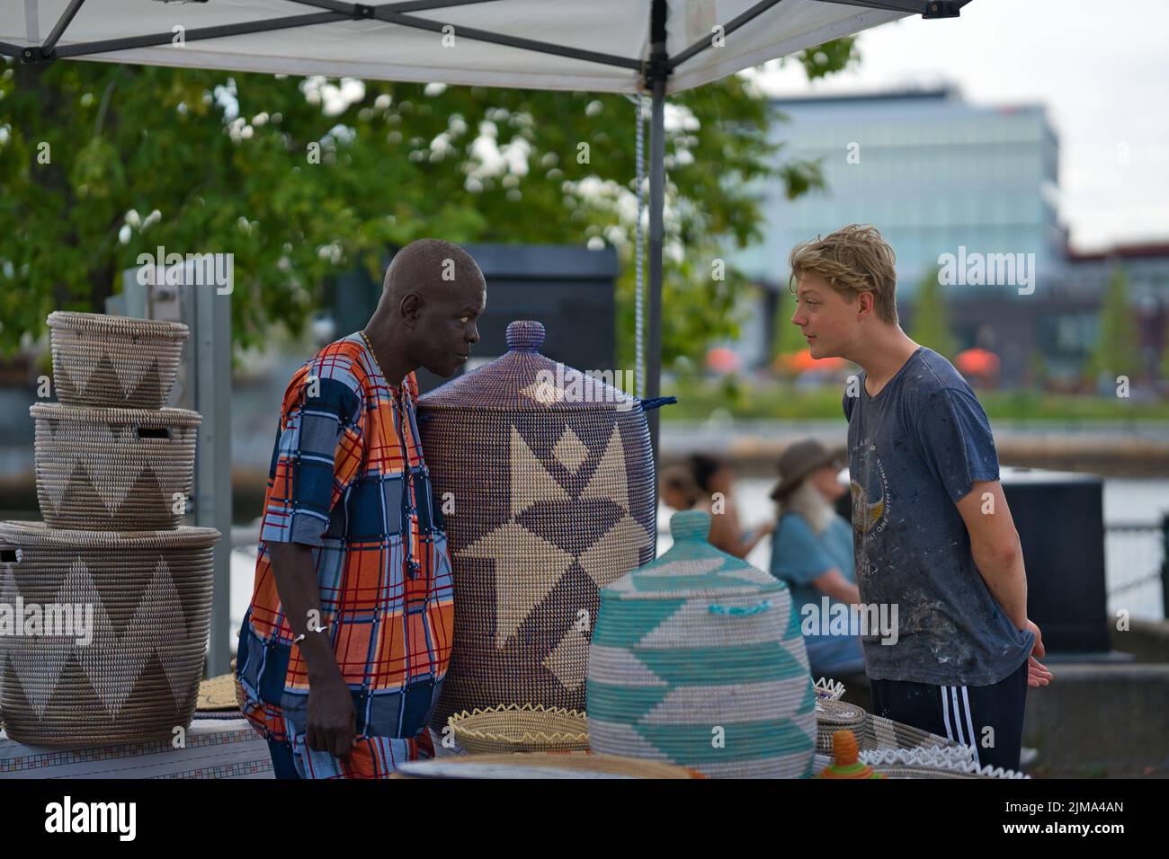 The friendly consultant helps customer make choice in an open-air ...