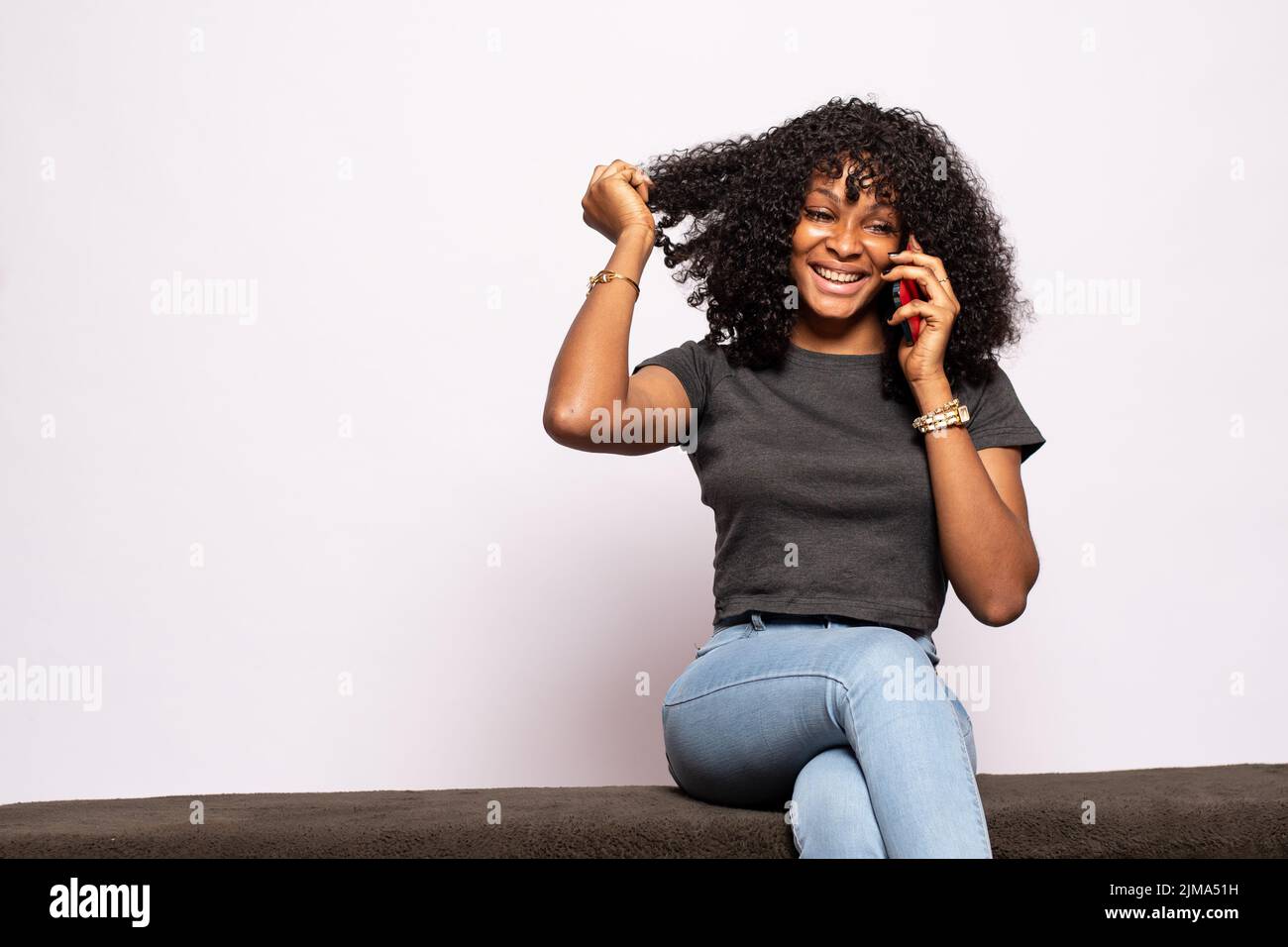 happy beautiful young black lady making a phone call Stock Photo - Alamy