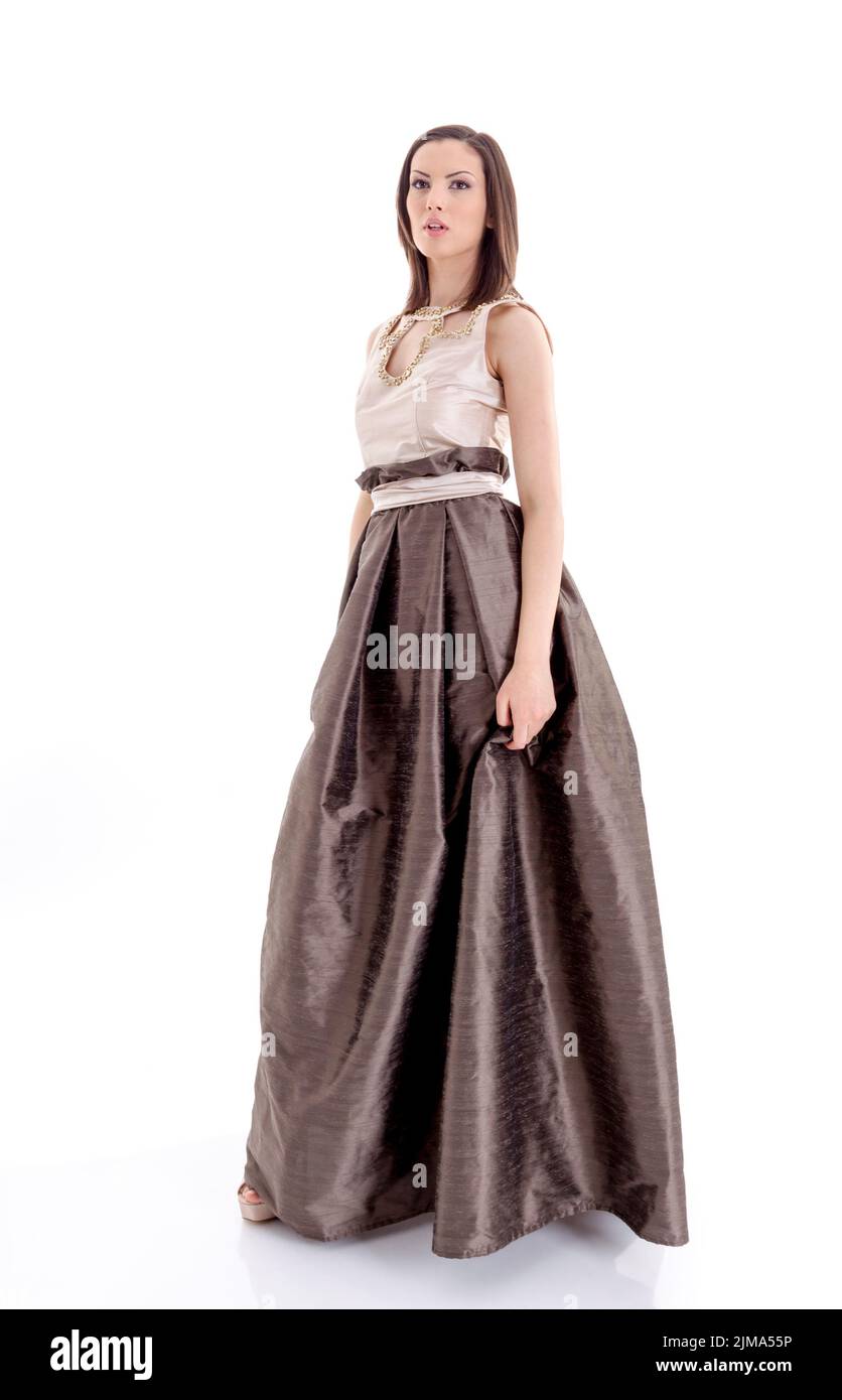 Beautiful woman model posing in elegant dress in the studio Stock Photo ...