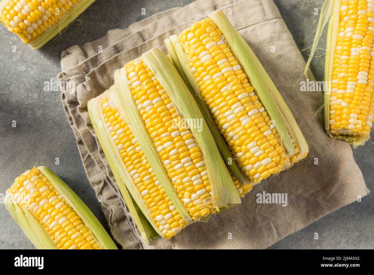 Raw Organic Yellow Sweet Corn on the Cob Ready to Cook Stock Photo - Alamy