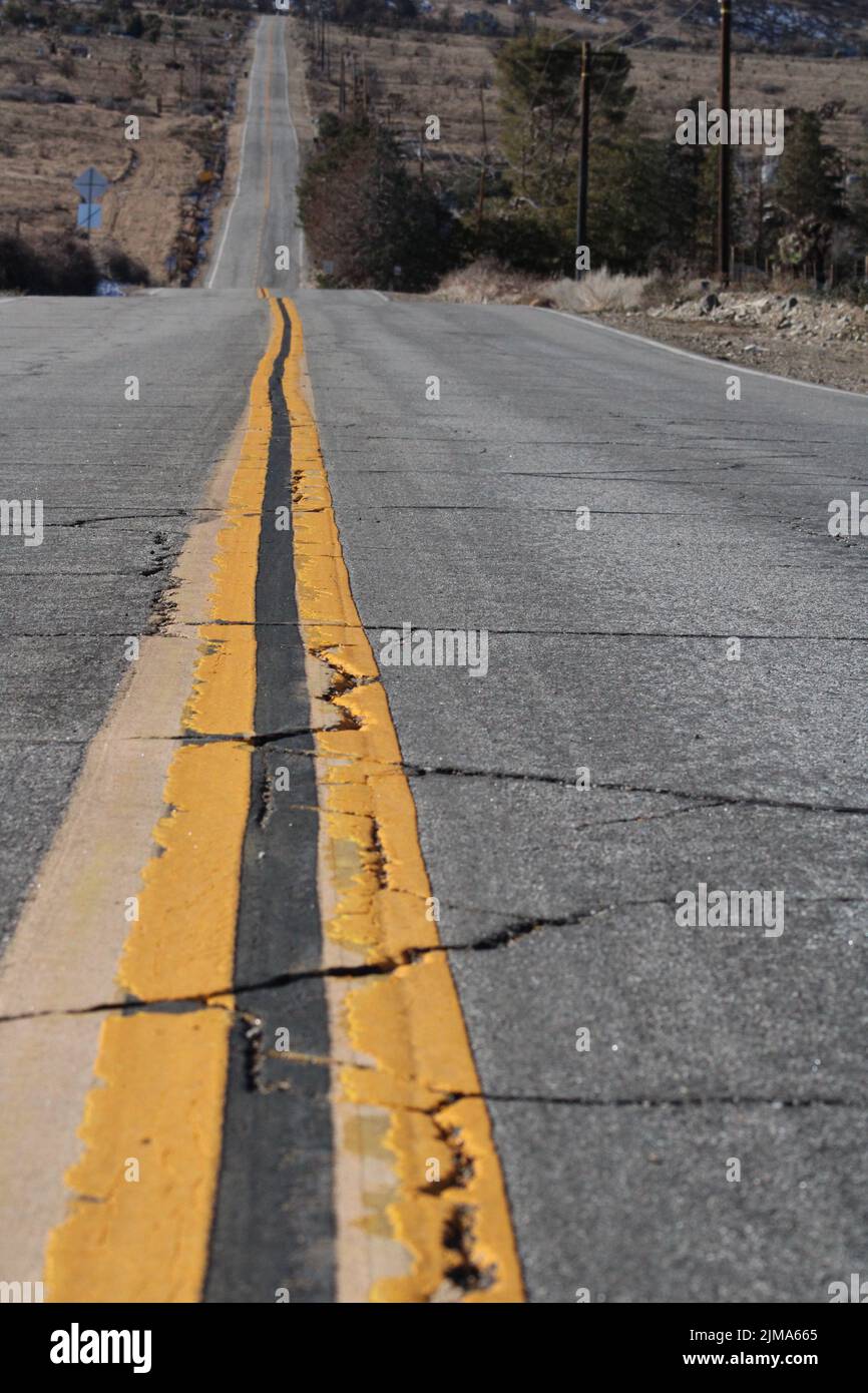 A vertical view of a long rural road Stock Photo - Alamy