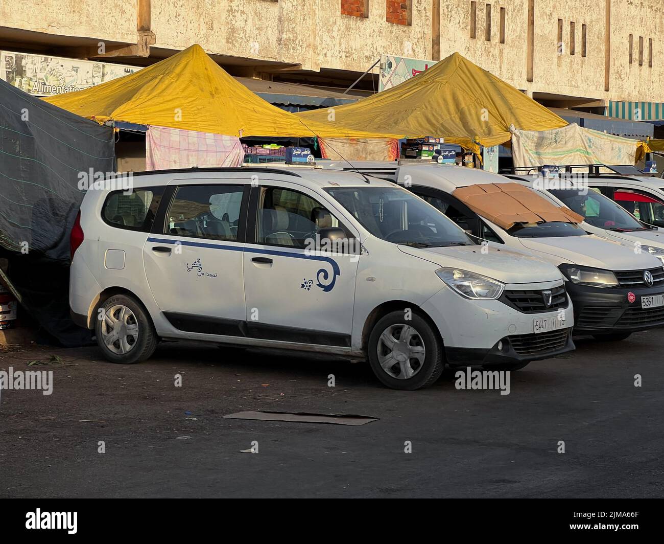 Fnideq intercity taxis parked on the road Stock Photo - Alamy