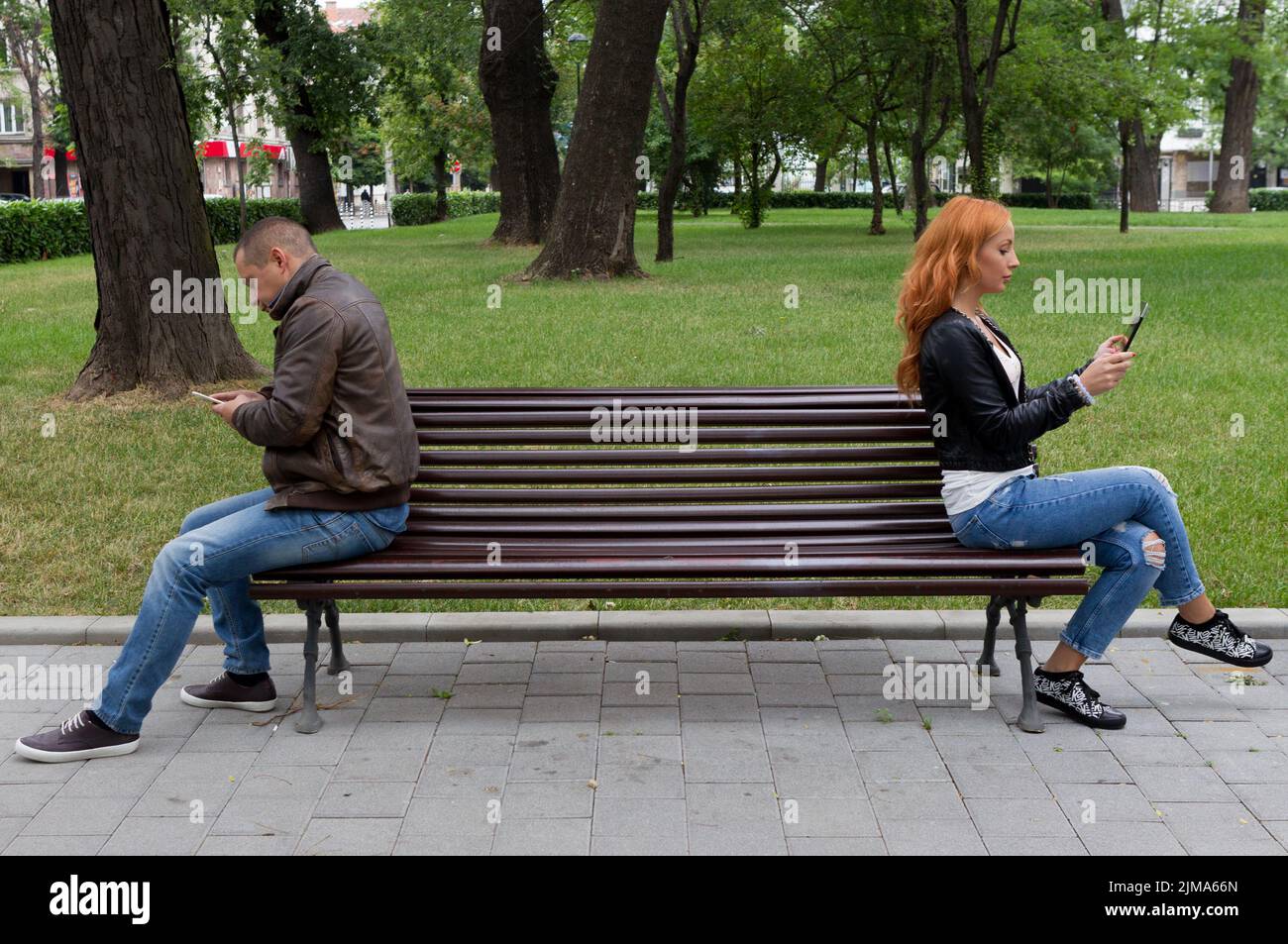 Friends are fun to watch something on a mobile phone laughing happily ...