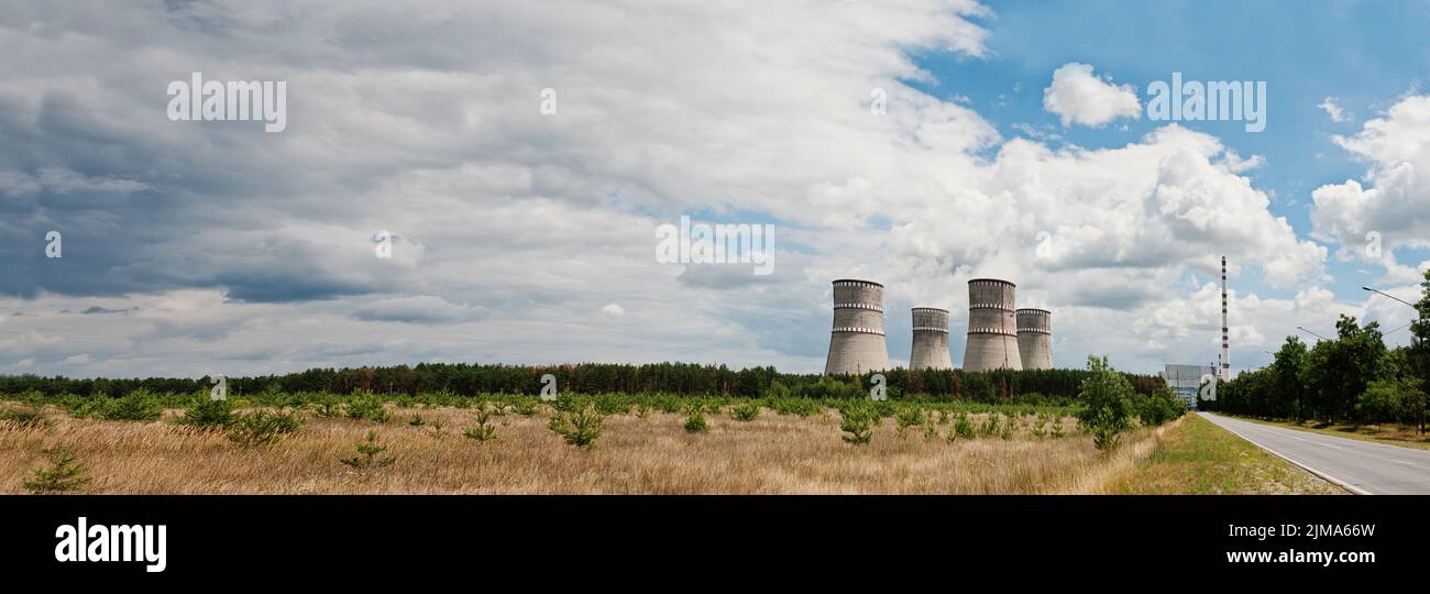 Large panorama of nuclear power station. Tops of cooling towers of ...
